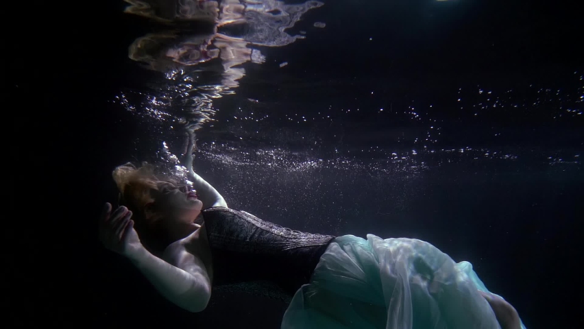 gorgeous woman sinking underwater diving darkness Stock Footage Video ...