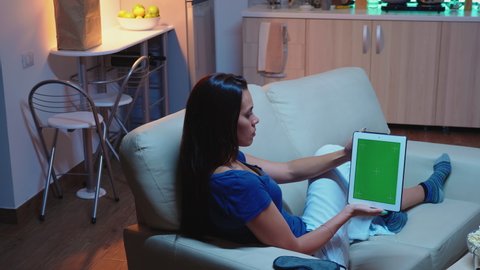 Woman Holding Touchpad Green Screen Sitting Stock Footage Video (100% ...