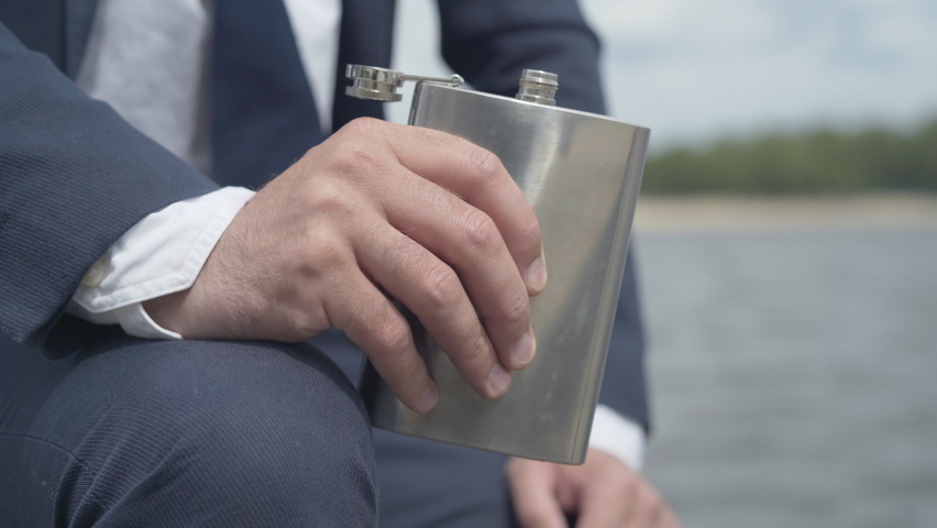 close-up male hand holding flask alcohol Stock Footage Video (100% ...