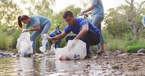 Multiethnic Group Conservation Volunteers Cleaning River Stock Footage ...