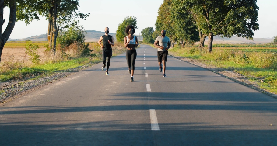 mixed-races young males female joggers running Stock Footage Video (100 ...