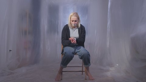 Female Hostage Sits On Chair Dark Stock Footage Video (100% Royalty ...