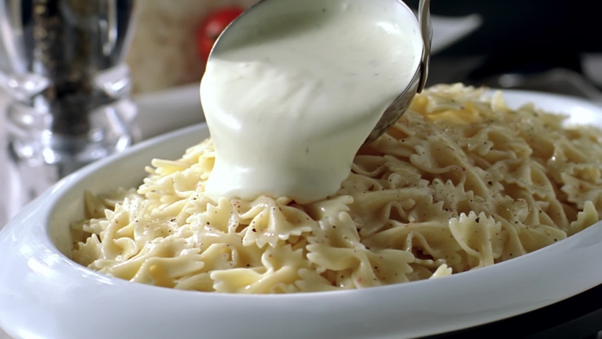 sauce poured over pasta on serving Stock Footage Video (100% Royalty ...