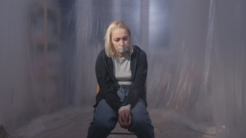 Female Hostage Sits On Chair Dark Stock Footage Video (100% Royalty ...