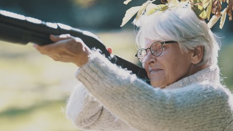 Old woman gun Stock Video Footage - 4K and HD Video Clips | Shutterstock