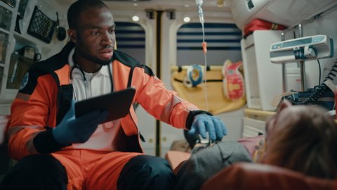 Black Ems Professional Paramedic Using Tablet Stock Footage Video (100% ...