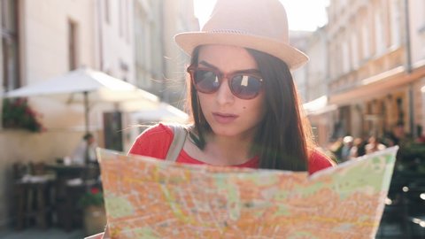 Girl looking map Stock Video Footage - 4K and HD Video Clips | Shutterstock