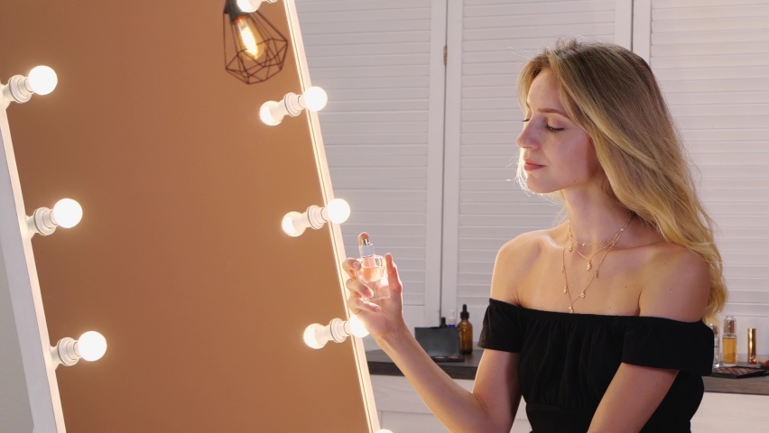 beautiful young woman spraying on perfume Stock Footage Video (100% ...