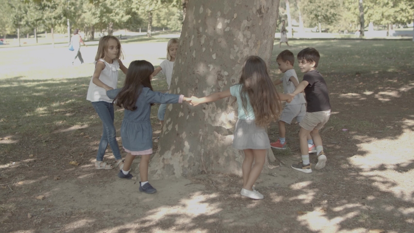 cheerful kids round dancing around tree Stock Footage Video (100% ...