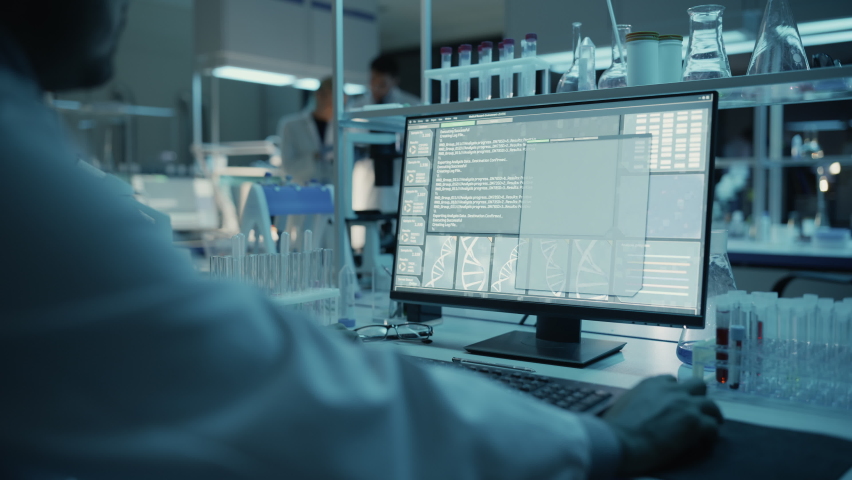 medical research scientist typing sophisticated coding Stock Footage ...