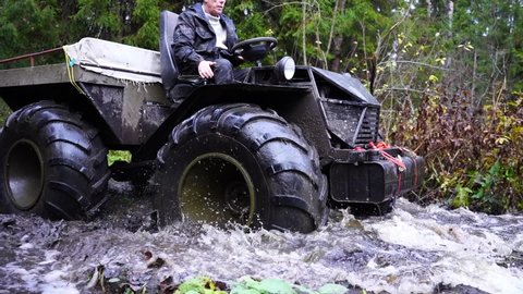 Hunter Rides Swamp Vehicle Through Forest Stock Footage Video (100% ...