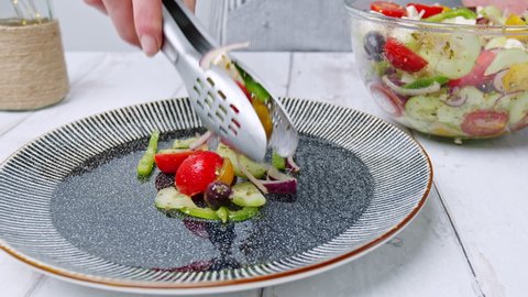 Arranging Greek Salad Ingredients Tong Into Stock Footage Video (100% ...