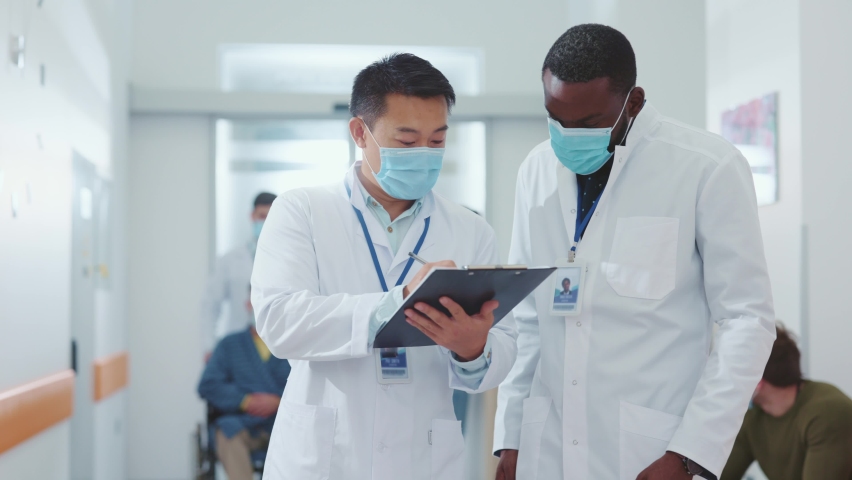 Asian African Doctors Discussing New Disease Stock Footage Video (100% ...