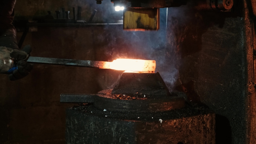 bladesmith working hot blade hydraulic forge Stock Footage Video (100% ...