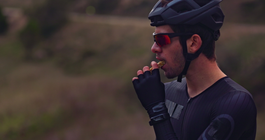 Professional Cyclist Eating Snack Bar Stock Footage Video (100% Royalty ...