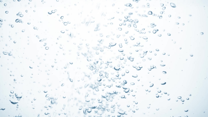 Extreme close up background of pouring pure clear sparkling water with ...