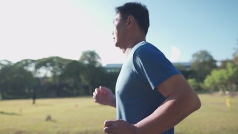 Asian Senior Man Running Inside Park Stock Footage Video (100% Royalty ...