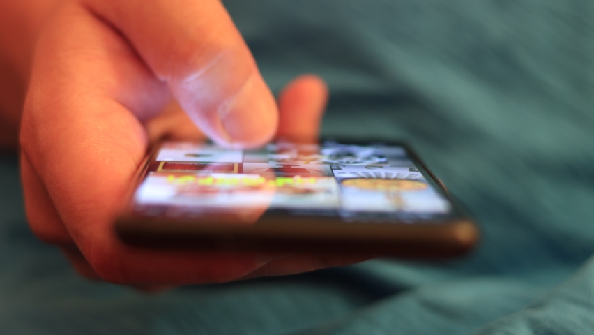 man flipping through photos on his Stock Footage Video (100% Royalty ...