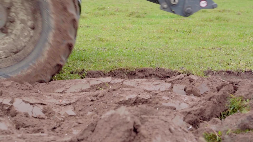 Heavy tracked tractor rides through the mud Industrial Videos ...