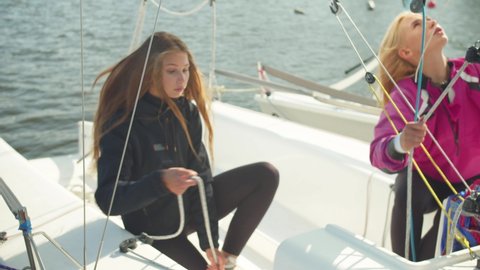 Two Cute Girls Prepare Sailing Yacht Stock Footage Video (100% Royalty ...