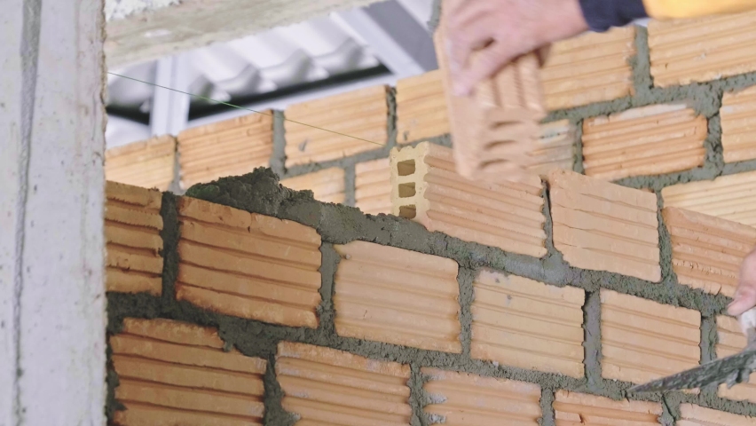 builder's hand puts brick masonry wall Stock Footage Video (100% ...