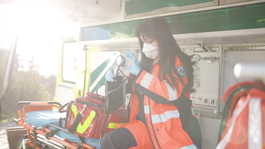 young female paramedic sits inside emergency Stock Footage Video (100% ...