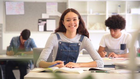 Happy Student Taking Notes While Studying Stock Photo (Edit Now) 1860471403