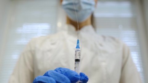 nurse stabbing syringe into ampoule draw Stock Footage Video (100% ...