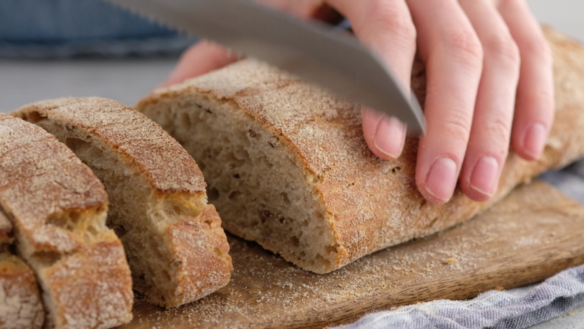 woman cutting homemade organic baguette bread Stock Footage Video (100% ...