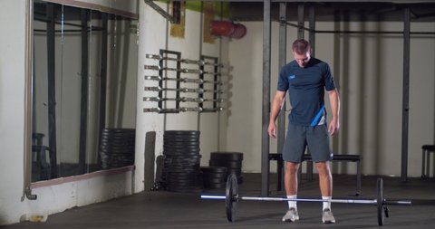 Man Lifting Weights Gym Alone Working Stock Footage Video (100% Royalty ...