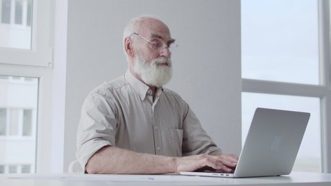 Serious Old Man Typing On Laptop Stock Footage Video (100% Royalty-free ...