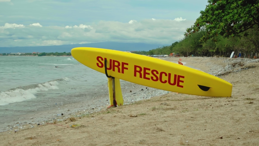yellow surfboard on beach red text Stock Footage Video (100% Royalty ...