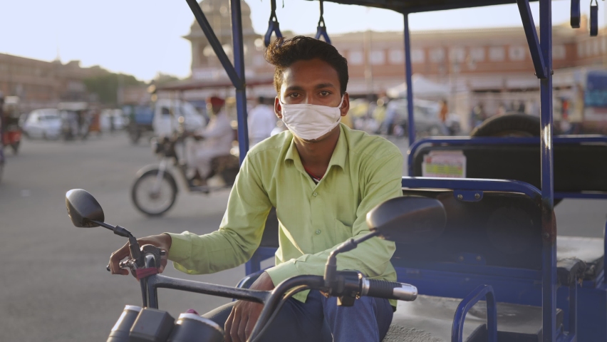 young indian male electric auto-rickshaw driver Stock Footage Video ...