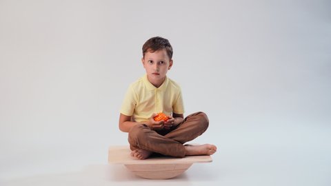 Little Boy Balancing On Simulator Throws Stock Footage Video (100% ...