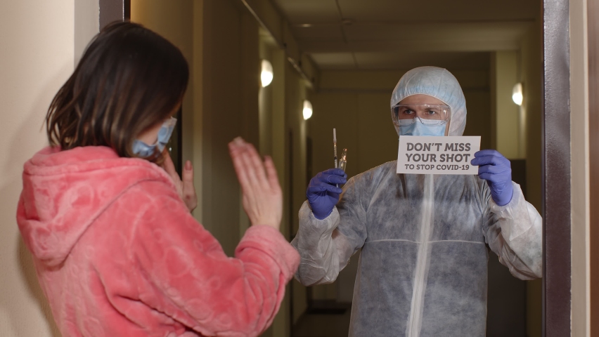 Stop global vaccination. Female doctor showing ampoule with vaccine and ...