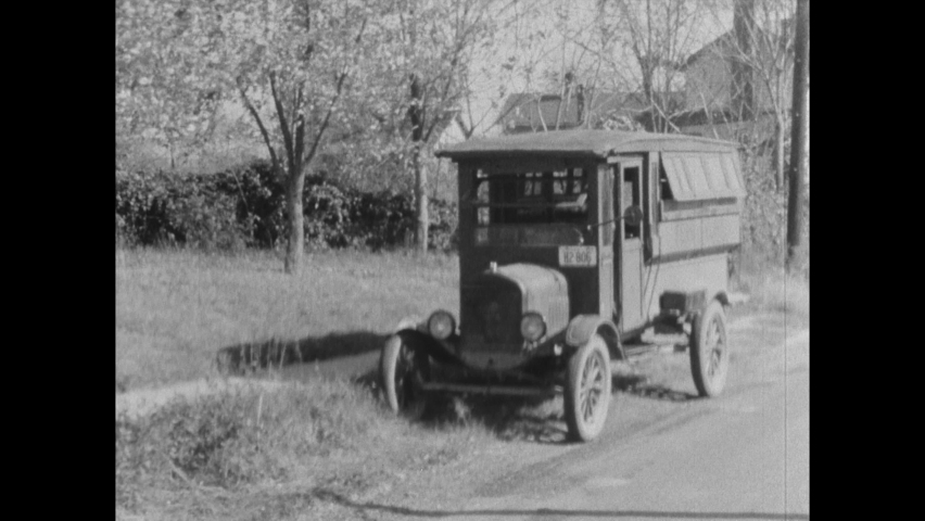 1930s school bus drives down road Stock Footage Video (100% Royalty ...