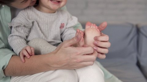 Little Baby Girl Touching Her Legs Stock Footage Video (100% Royalty ...