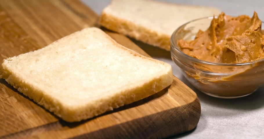Bread with Peanut Paste. Knife Stock Footage Video (100% Royalty-free ...