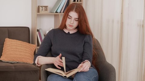 Calm Red Hair Female Student Reading Stock Footage Video (100% Royalty ...