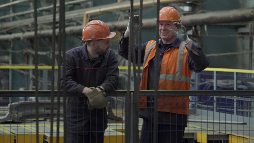 two male factory workers having break Stock Footage Video (100% Royalty ...