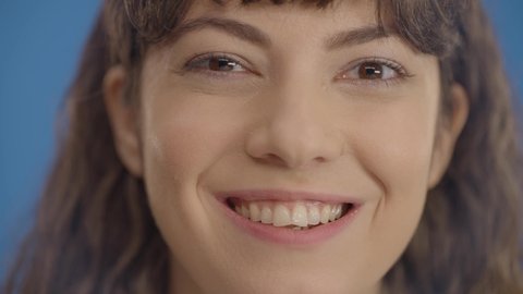 Smiling Winking Young Woman On Blue Stock Footage Video (100% Royalty ...