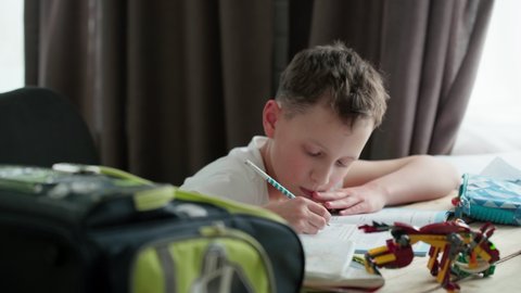 Capable Schoolboy 8 Years Old Writes Stock Footage Video (100% Royalty ...