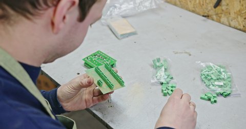 Male Technician Assembling Microcircuit Over Workbench Stock Footage ...