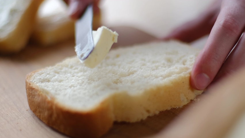 hand smears vegan butter on yeast-free Stock Footage Video (100% ...