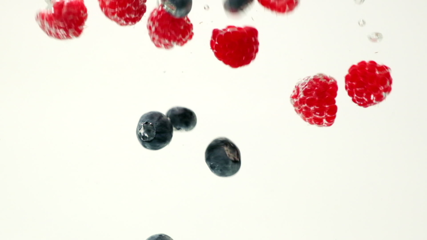 Raspberry Blueberry Mulberry Falling Into Transparent Stock Footage ...