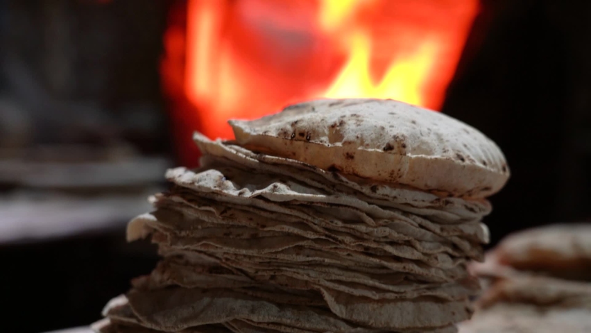 Indian cuisine tandoori roti making in original clay oven, Indian flat ...