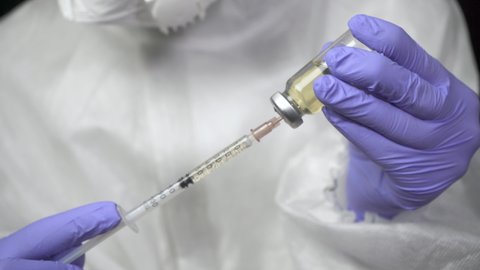 nurse stabbing syringe into ampoule draw Stock Footage Video (100% ...