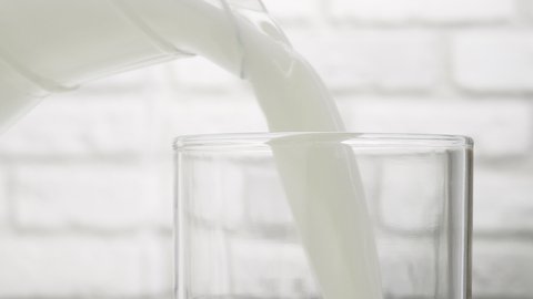 Closeup Pouring Milk Jug Into Glass Stock Footage Video (100% Royalty ...