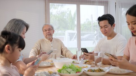 Asian Addicted Family Using Mobile Phone Stock Footage Video (100% ...