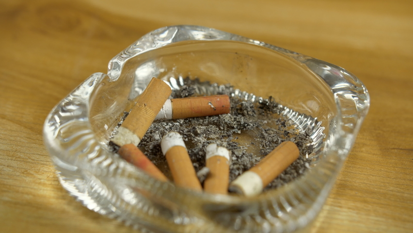 female smoker's hand putting out cigarette Stock Footage Video (100% ...